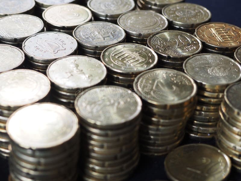 High-angle Shot of 20 Cents Coin Stacks Under the Bright Light Stock ...