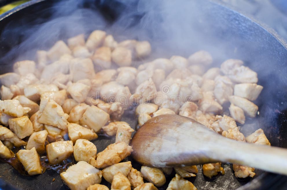 High Angle Shot of Chicken Cooked in Cubes on a Pan Stock Photo - Image ...