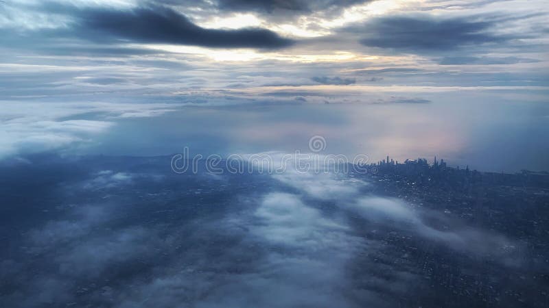 High Angle Shot of a City Panorama Above the Clouds Stock Image - Image ...