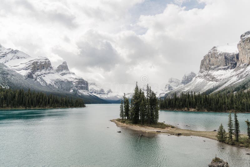 High Angle Shot of a Clear Frozen Lake Surrounded by a Mountainous ...