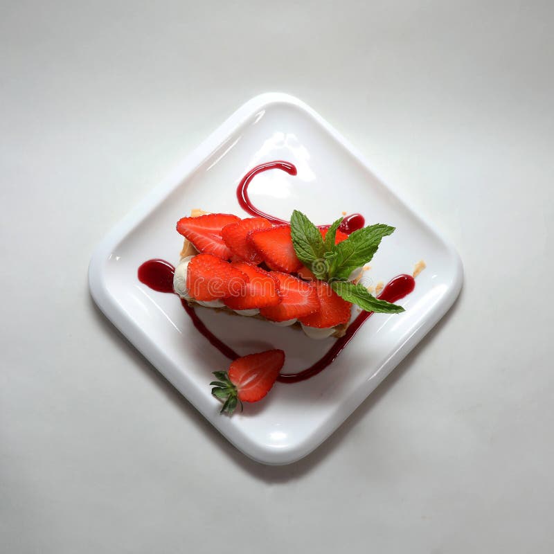 High Angle Shot of a Delicious Strawberry Milfoy Cake in a Plate on a ...