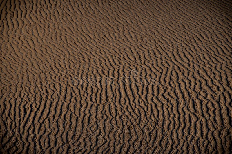 High Angle Shot of a Desert Dune with Sand Trail Textures Stock Photo ...