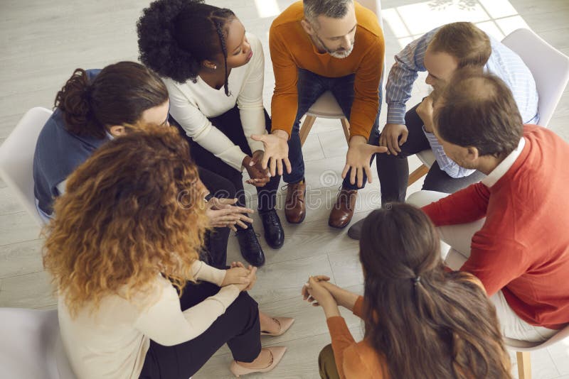 High Angle Shot of Diverse People Working on Their Problems in Group ...