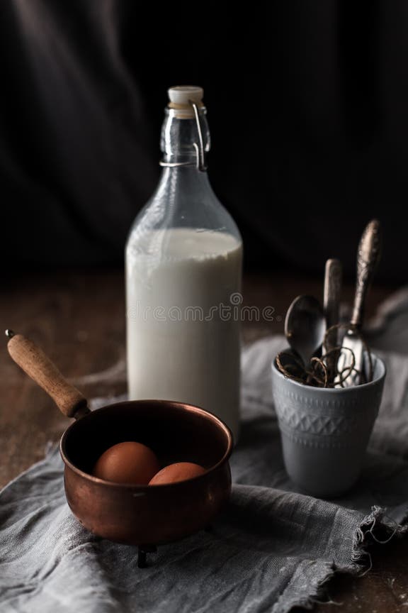 High-angle Shot of Eggs, a Bottle of Milk and Utensils for Baking Stock ...