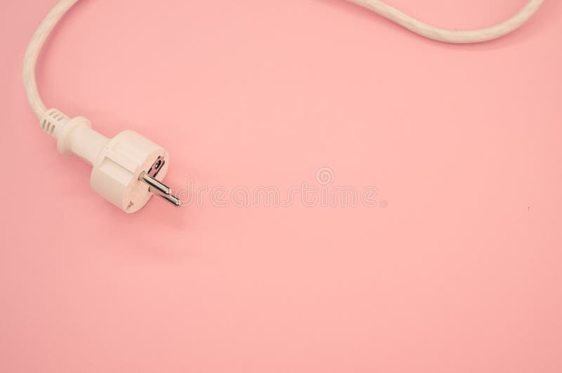 High Angle Shot of an Electrical Wire and Plug on a Pink Surface Stock ...