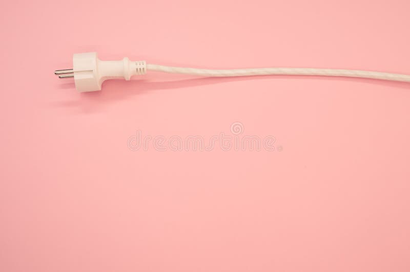 High Angle Shot of an Electrical Wire and Plug on a Pink Surface Stock ...