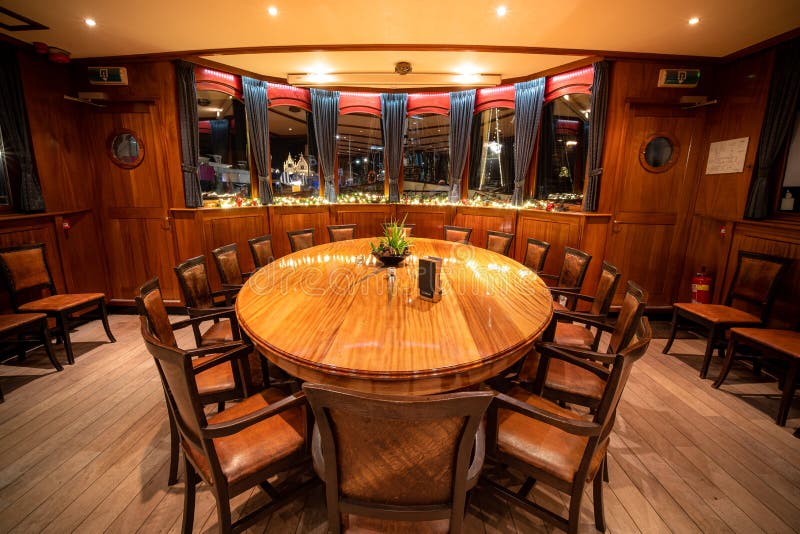 High Angle Shot of a Fancy Restaurant Round Table with Windows on the ...