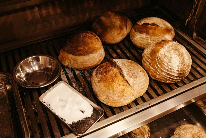 High-angle Shot of the Fresh Baked Crusty Bread Put on the Oven Racks ...