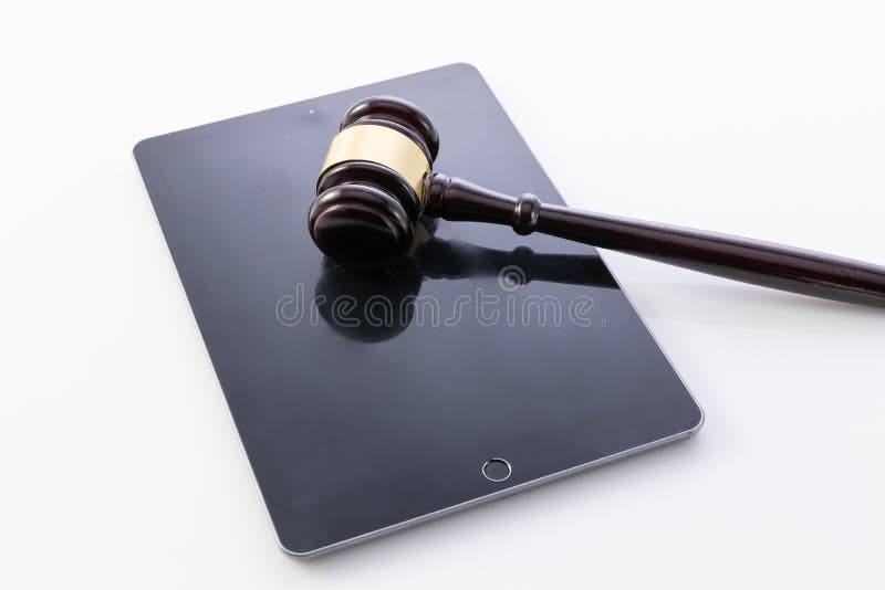High Angle Shot of a Gavel and a Tablet on a White Surface Stock Photo ...