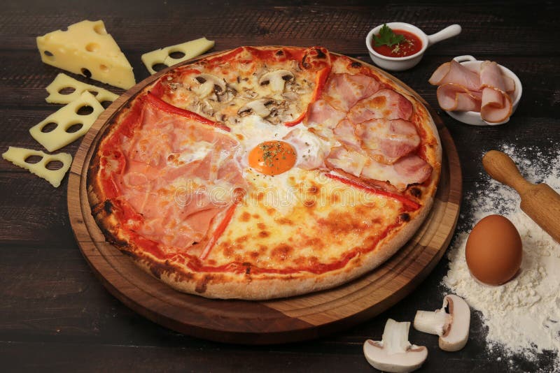 High Angle Shot of a Gourmet Pizza with Various Toppings on a Messy ...