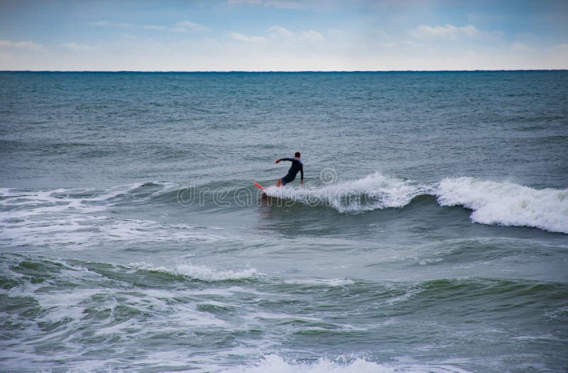 High Angle Shot of a Guy Surfing on an Ocean Wave Stock Photo - Image ...