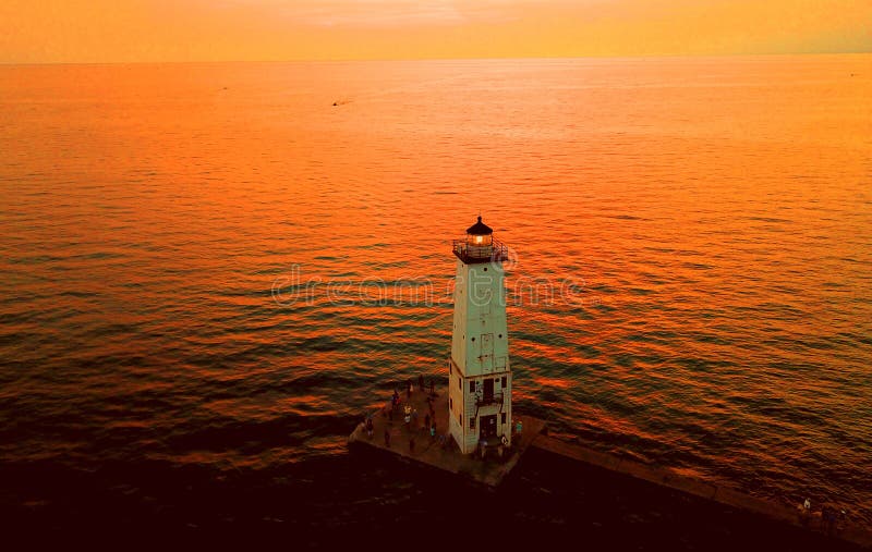 High Angle Shot of a Lighthouse in the Sea with a Beautiful Scenery of ...