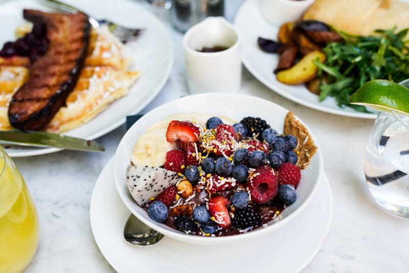 High Angle Shot of a Lunch Table with a Plate Filled with Berries in ...