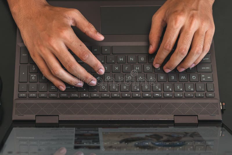 High Angle Shot of Male Hands Using a Laptop Stock Photo - Image of ...