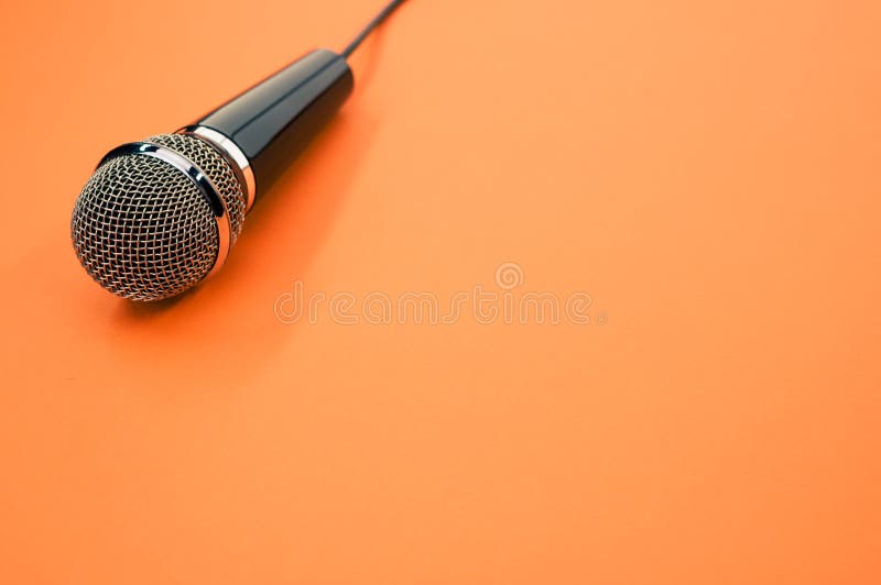 High Angle Shot of a Microphone on an Orange Surface Stock Photo ...