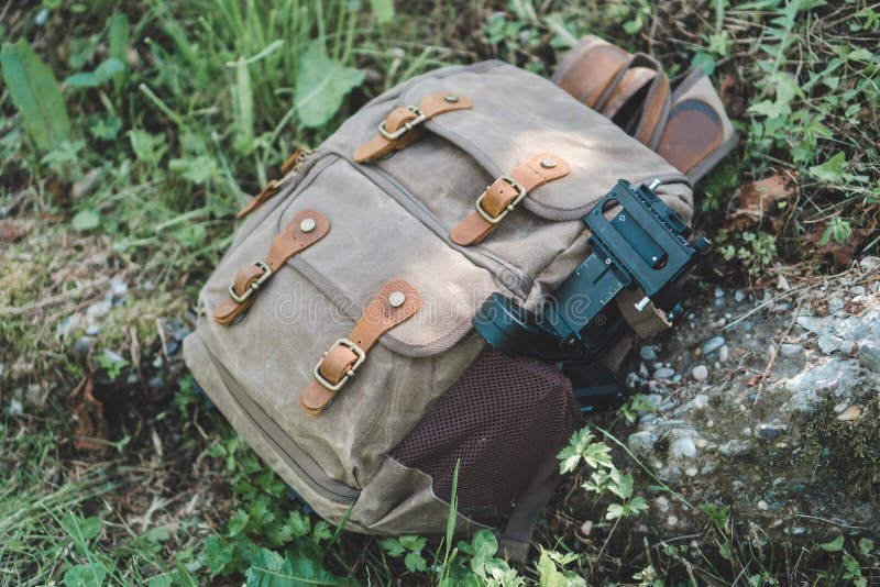 High Angle Shot of a Modern Backpack with a Camera Stand in it on the ...
