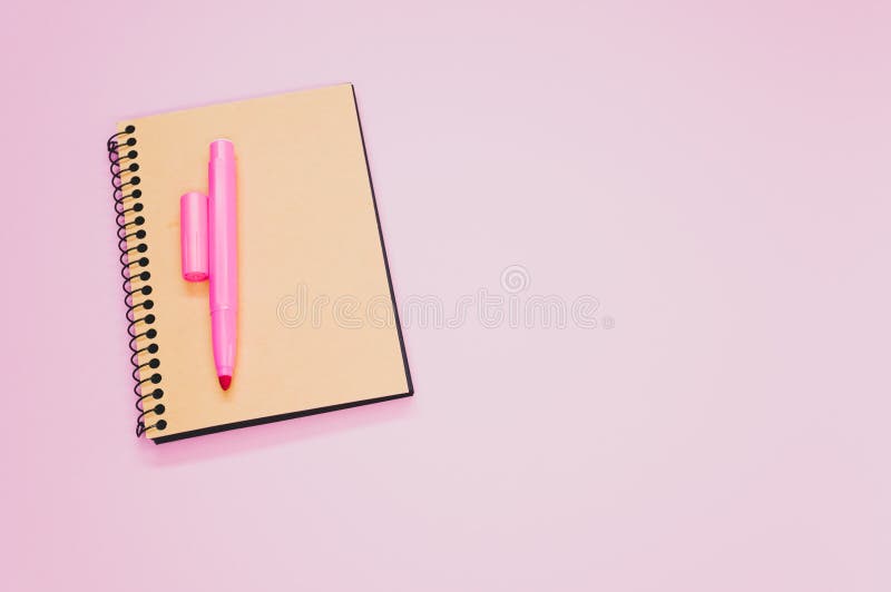 High Angle Shot of a Notebook and a Pink Marker on a Pink Surface Stock ...