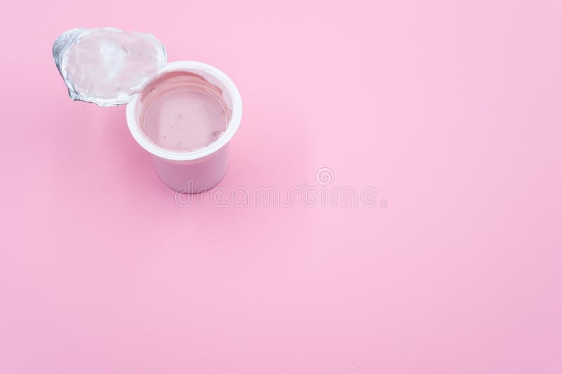 High Angle Shot of an Opened Plastic Container of Fruit Yogurt on a ...