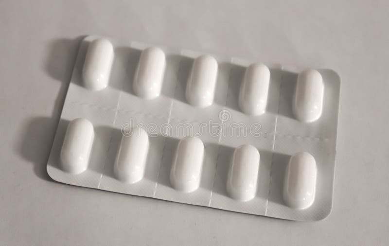 High Angle Shot of a Pack of Pills on a White Background Stock Image ...