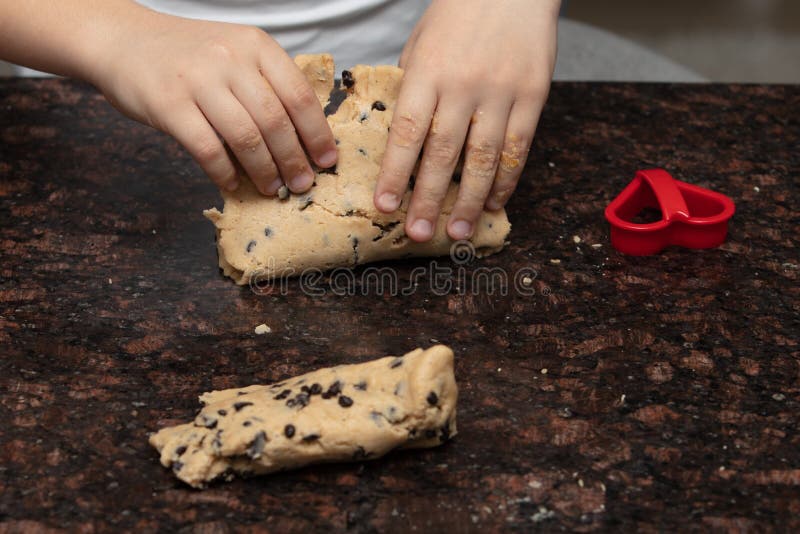 High Angle Shot of a Person S Hands Rolling Some Chocolate Chip Cookie ...