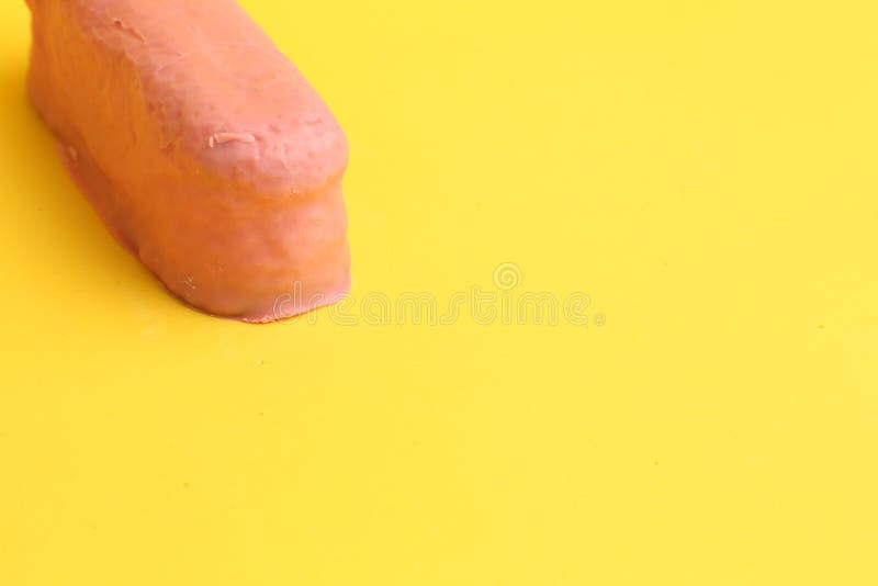 High Angle Shot of a Piece of Meat Paste Isolated on a Yellow Surface ...