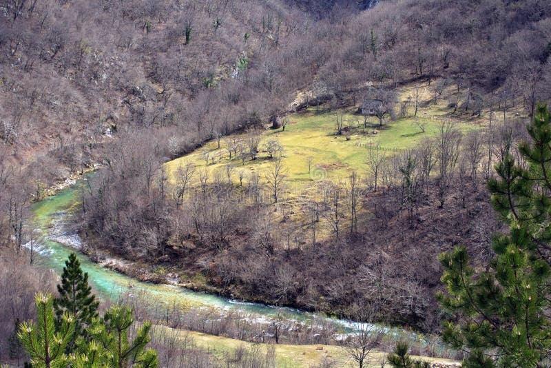 High Angle Shot of a River Flowing through Hills and Fields Stock Photo ...