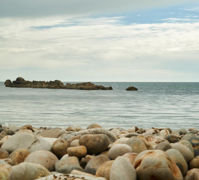 High Angle Shot of a Sea with Rocks Alongside Stock Photo - Image of ...