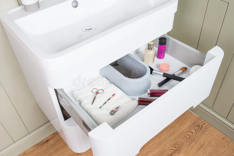 High Angle Shot of a Sink with Open Drawers in a Bathroom Stock Image ...