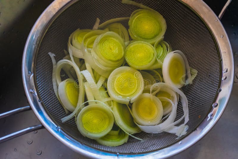 High Angle Shot of Sliced Onions in a Strainer in the Kitchen Sink ...