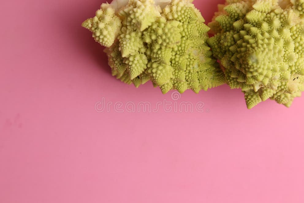 High Angle Shot of Some Fresh Broccoli Isolated on a Pink Surface Stock ...