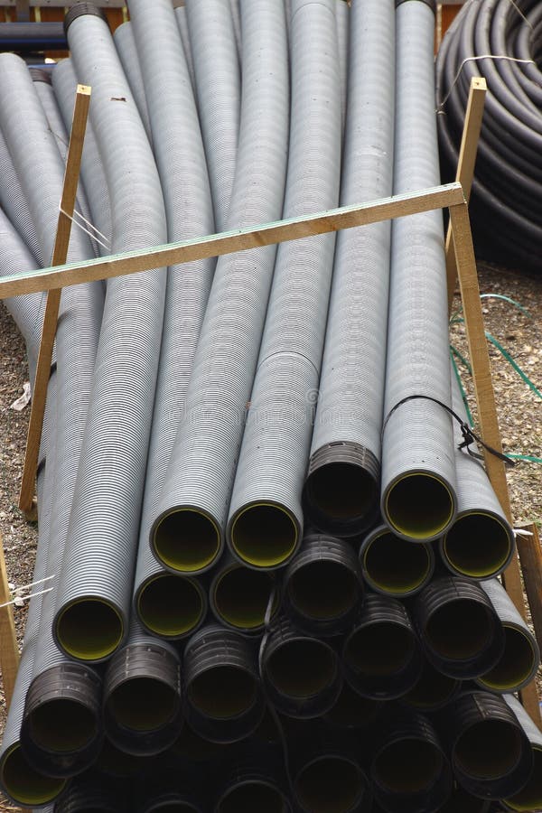High Angle Shot of a Stack of Water Pipes on Top of Each Other Stock ...