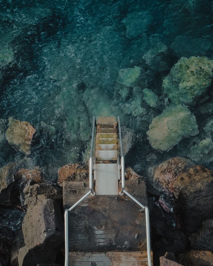 High-angle Shot of a Stairway Down To a Rocky Beach Stock Photo - Image ...