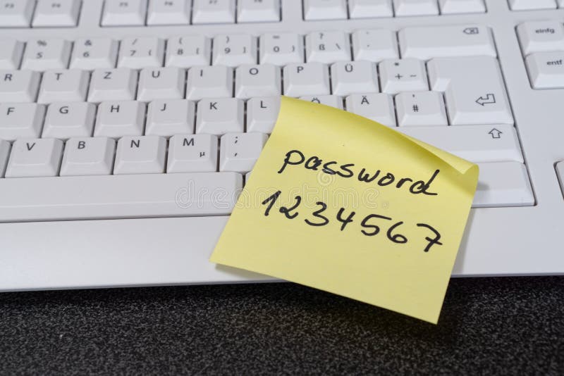High Angle Shot of a Sticky Note with a Password Written on it on a ...