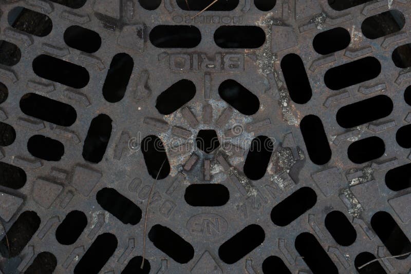 High Angle Shot of Storm-drain in the Middle of the Street Stock Photo ...