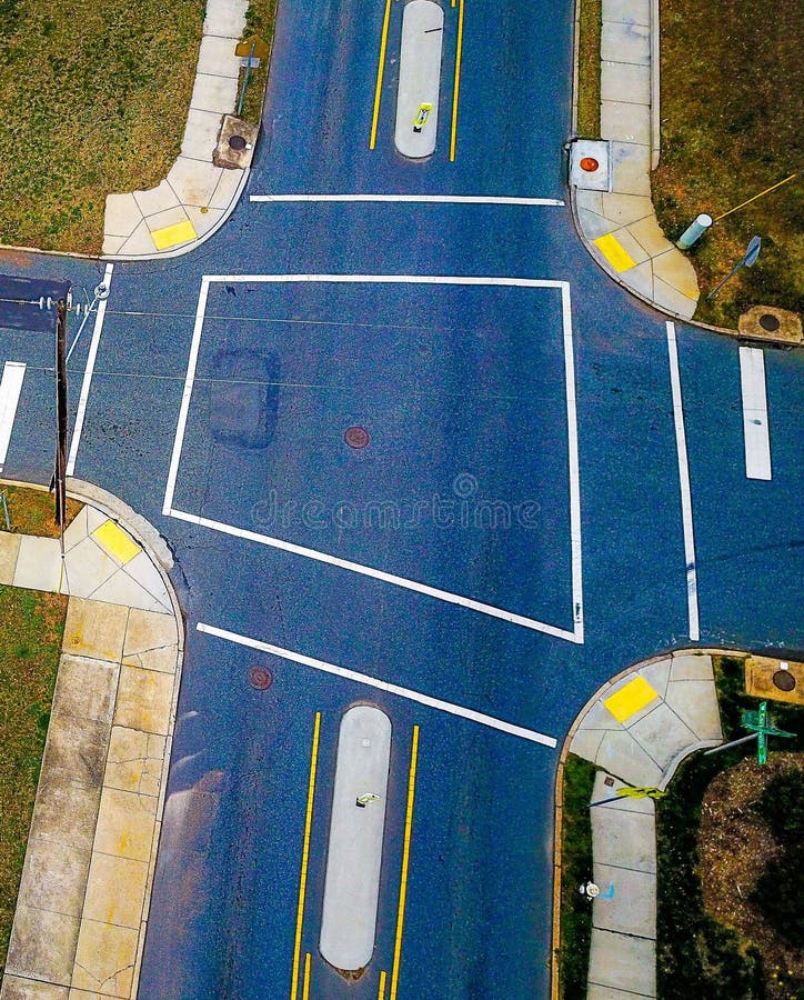 High Angle Shot of a Street Intersection with Sidewalks and Markings ...