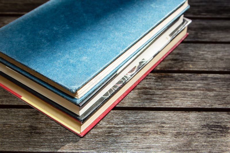 High Angle Shot of Three Thick Books on a Wooden Surface Stock ...