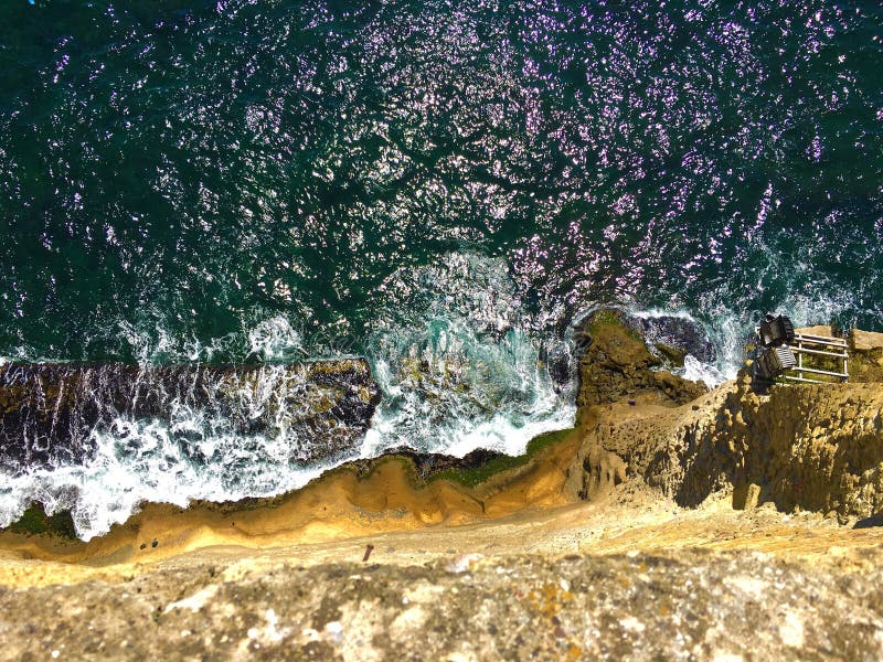 High Angle Shot from the Top of the Cliff with Sea Waves Hitting on the ...