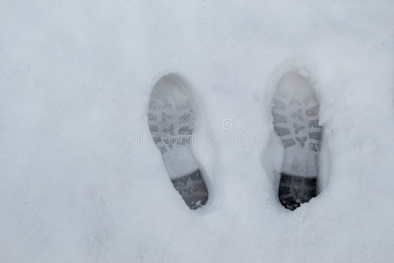 High Angle Shot of the Traces of Human Feet on the Snow Stock Image ...