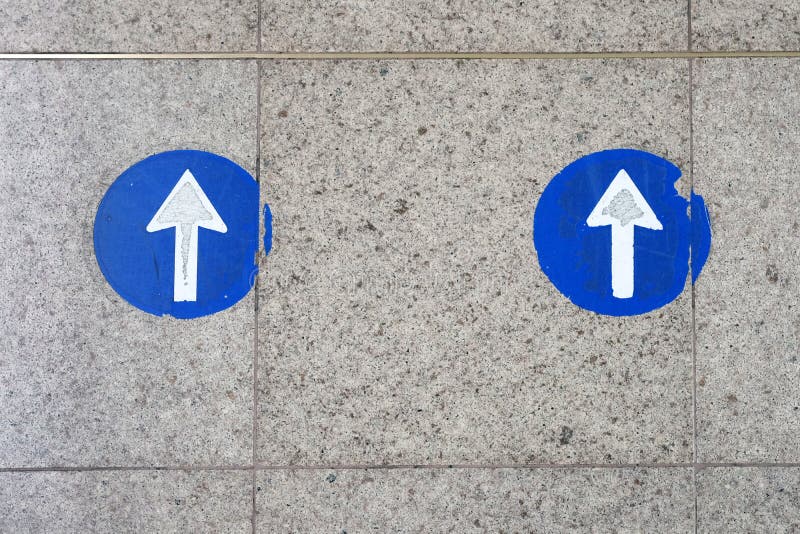 High Angle Shot of Two Road Signs with the Forward Direction on the ...