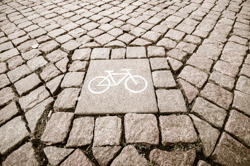 High Angle Shot of a White Bicycle Sign on the Stone Ground Stock Image ...