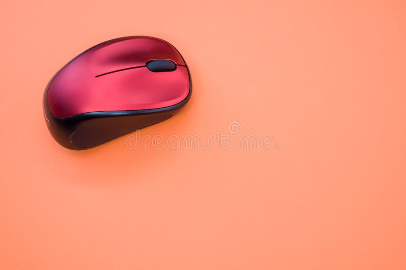High Angle Shot of a Wireless Mouse on an Orange Surface Stock Image ...