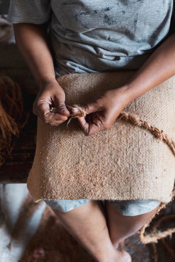 High Angle Shot of a Woman Hand Weaving a Straw String in the Daylight ...