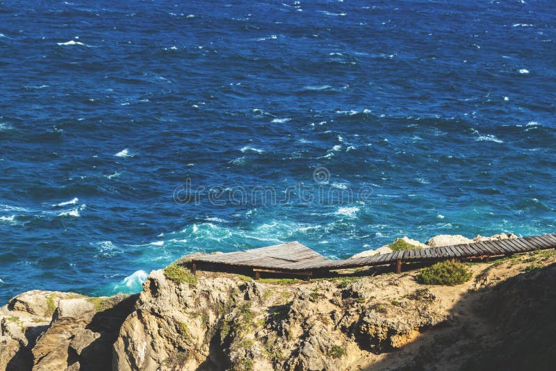 High Angle Shot of a Wooden Pathway on the Rocks Over the Beautiful ...