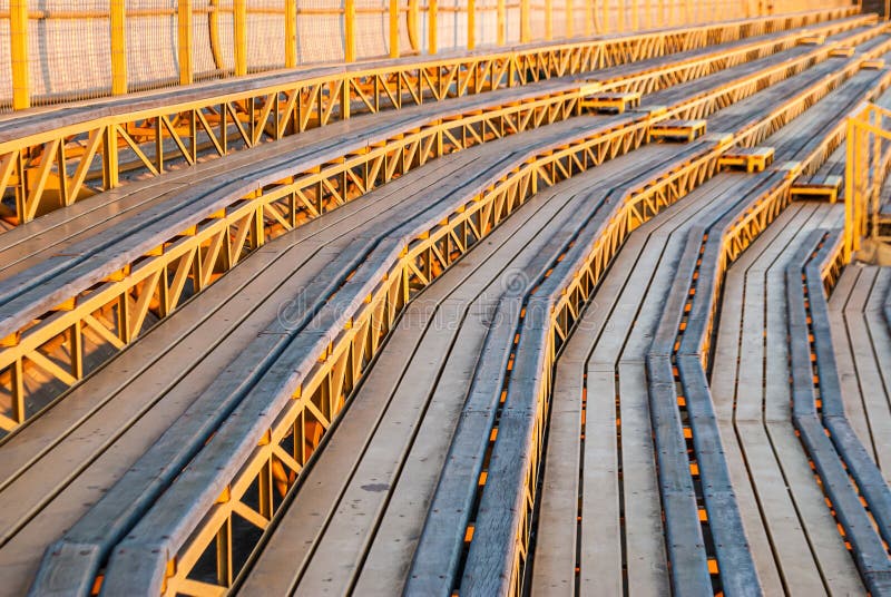 High Angle Shot of Wooden Stadium Seats Under the Sunlight Stock Photo ...