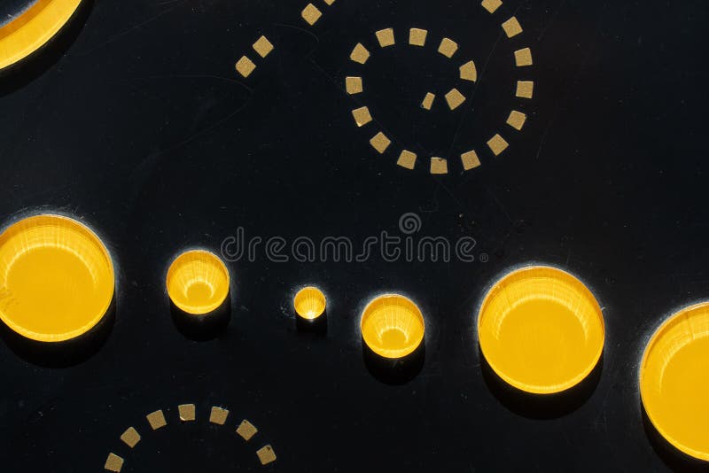 High Angle Shot of Yellow Round Objects on a Black Surface Stock Photo ...