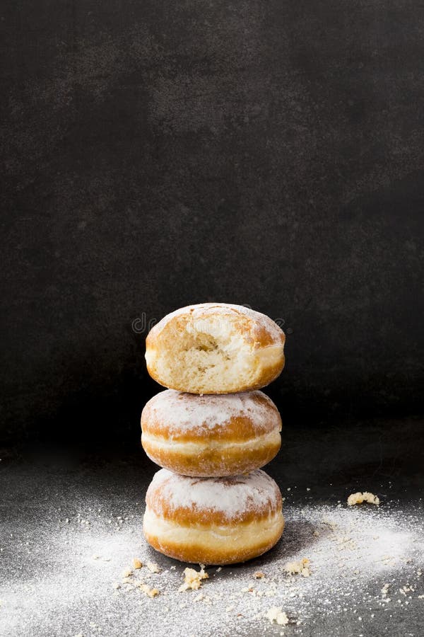 High Angle Stacked Donuts with Powdered Sugar. High Quality Photo Stock ...