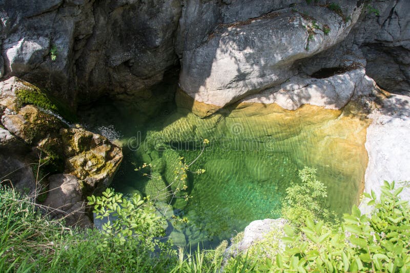 High Angle of the Turquoise Enipeus River in the Cliffs Illuminated by ...