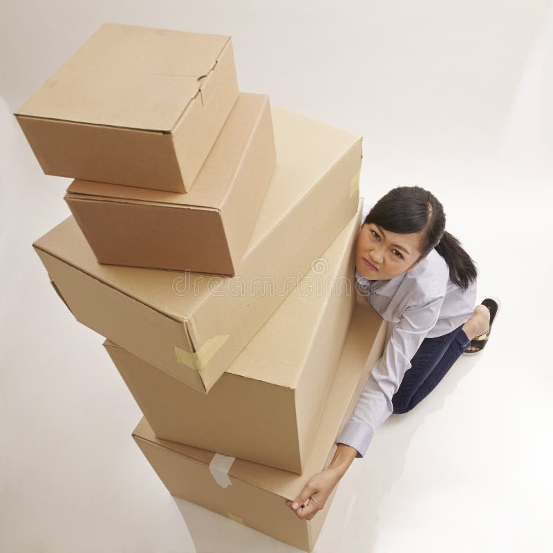 Woman lifting boxes stock photo. Image of relocation - 105789862