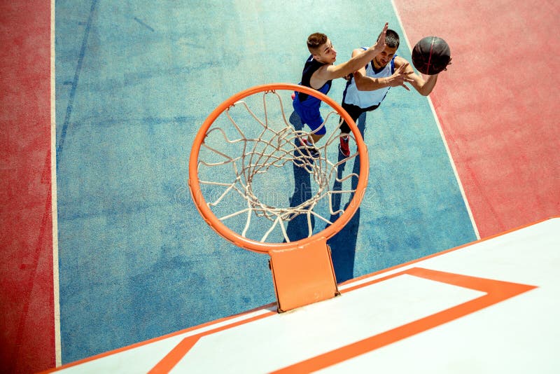 High Angle View of Basketball Player Dunking Basketball in Hoop Stock ...