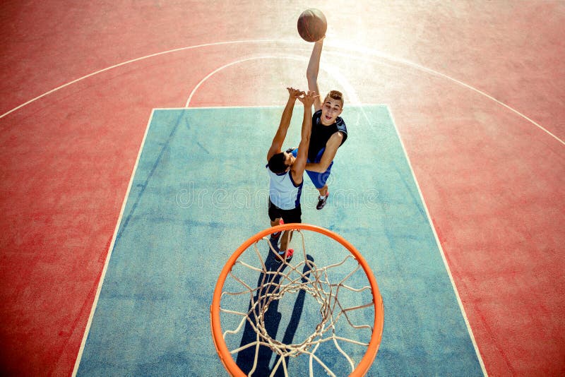 High Angle View of Basketball Player Dunking Basketball in Hoop Stock ...